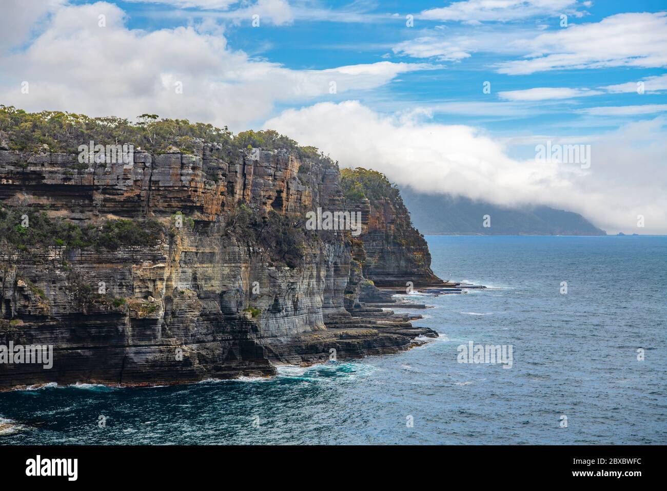 Rugged coastline cliffs and sea Tasman National Park Tasmania Australia ...