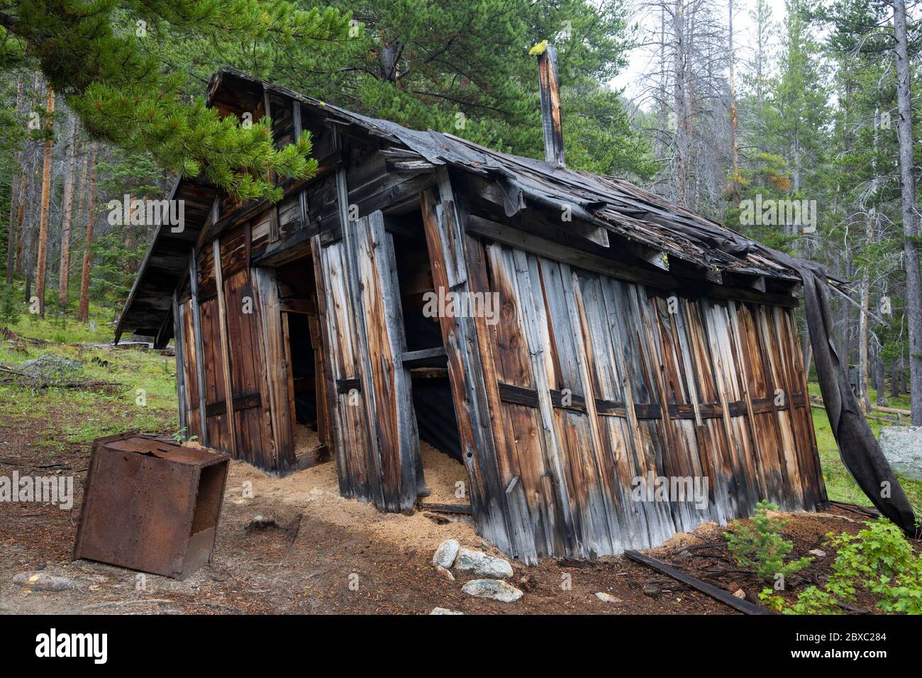 An old wooden building is leaning precariously in the silver mining ...
