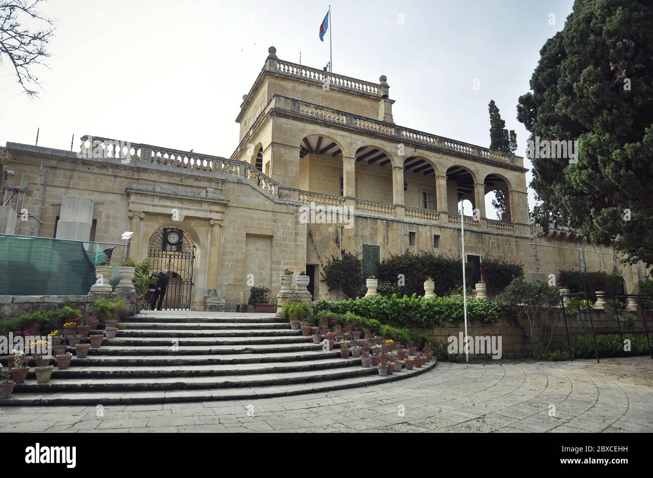 The limestone presidential palace in the San Anton Gardens. Steps are ...
