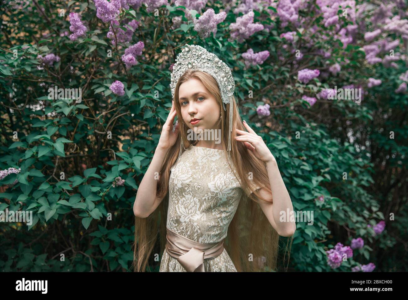 The girl in the crown. The magnificent Queen from a fairy tale among ...