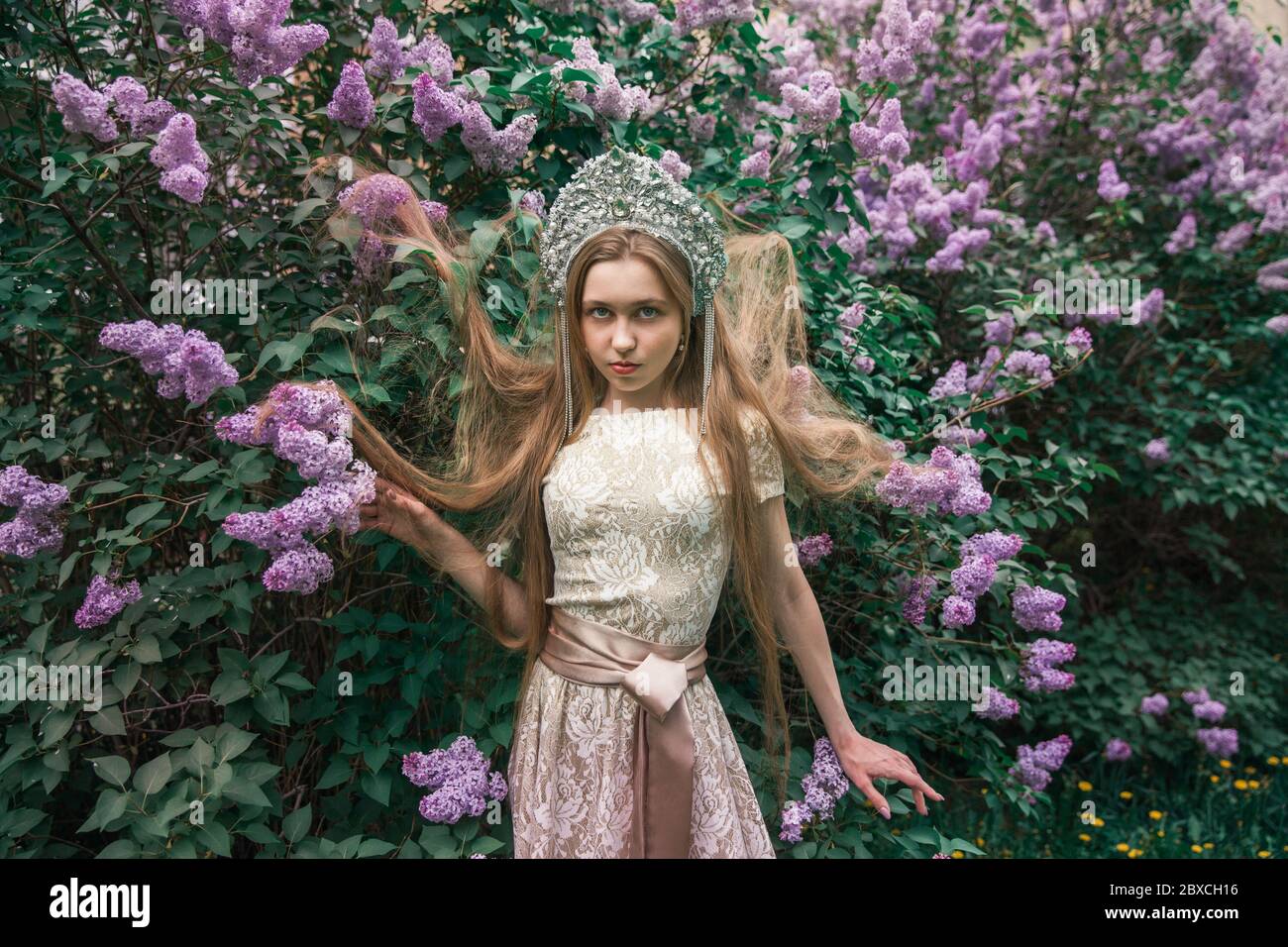The girl in the crown. The magnificent Queen from a fairy tale among ...