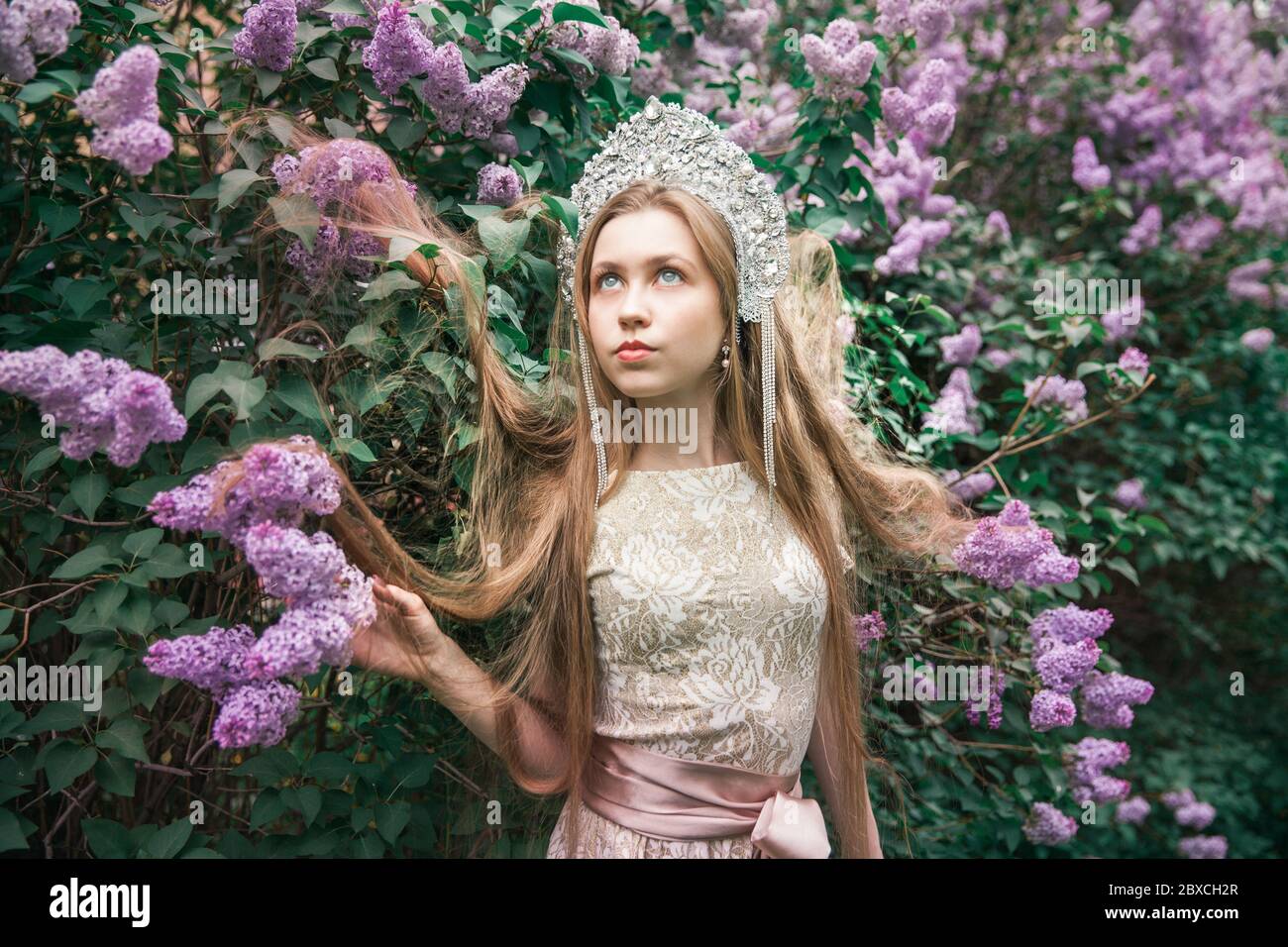 The girl in the crown. The magnificent Queen from a fairy tale among ...