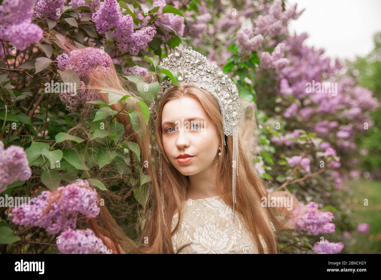 The girl in the crown. The magnificent Queen from a fairy tale among ...