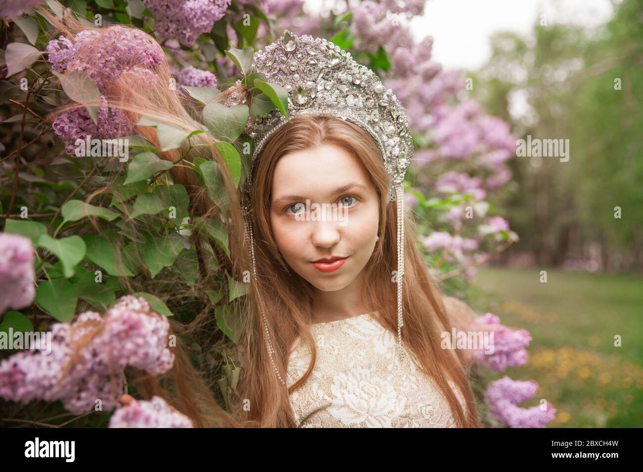 The girl in the crown. The magnificent Queen from a fairy tale among ...