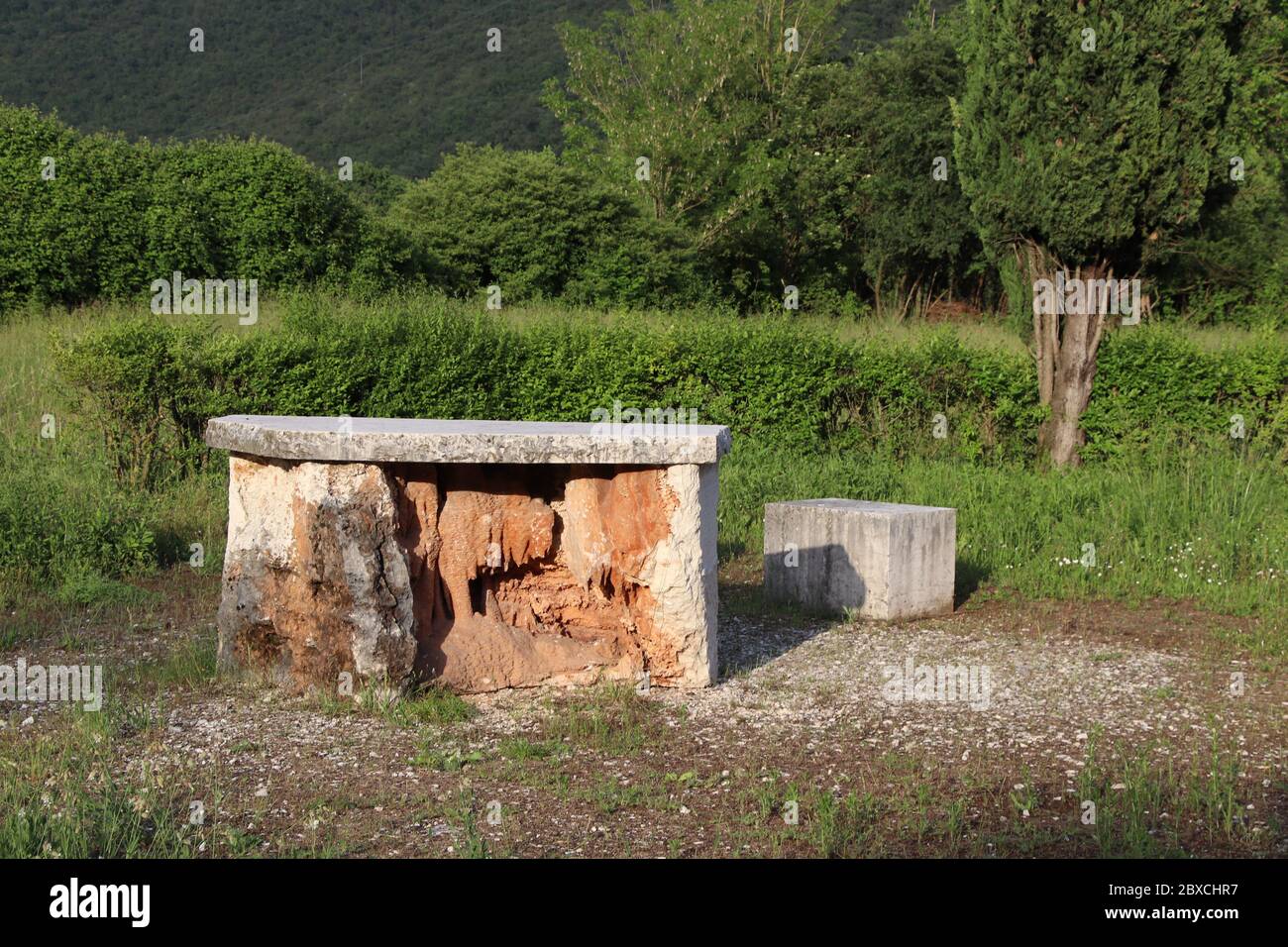 small stone altar in a meadow in Italy Stock Photo - Alamy