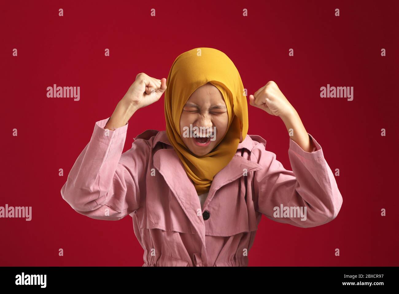 Portrait of happy success confident young teenage Asian muslim girl ...