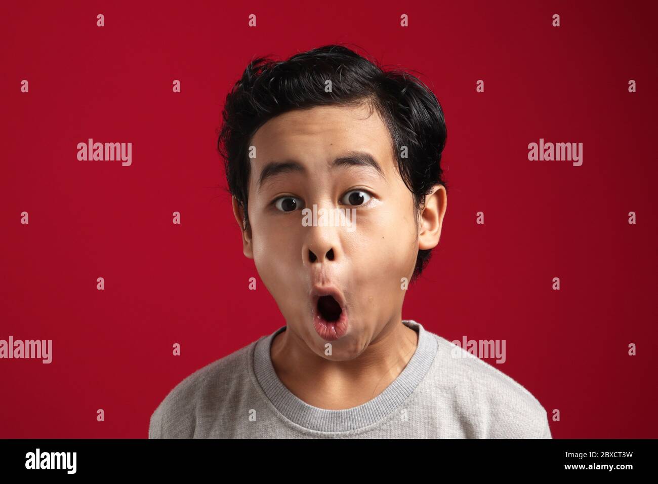 Asian teen boy shocked expression hi-res stock photography and images ...