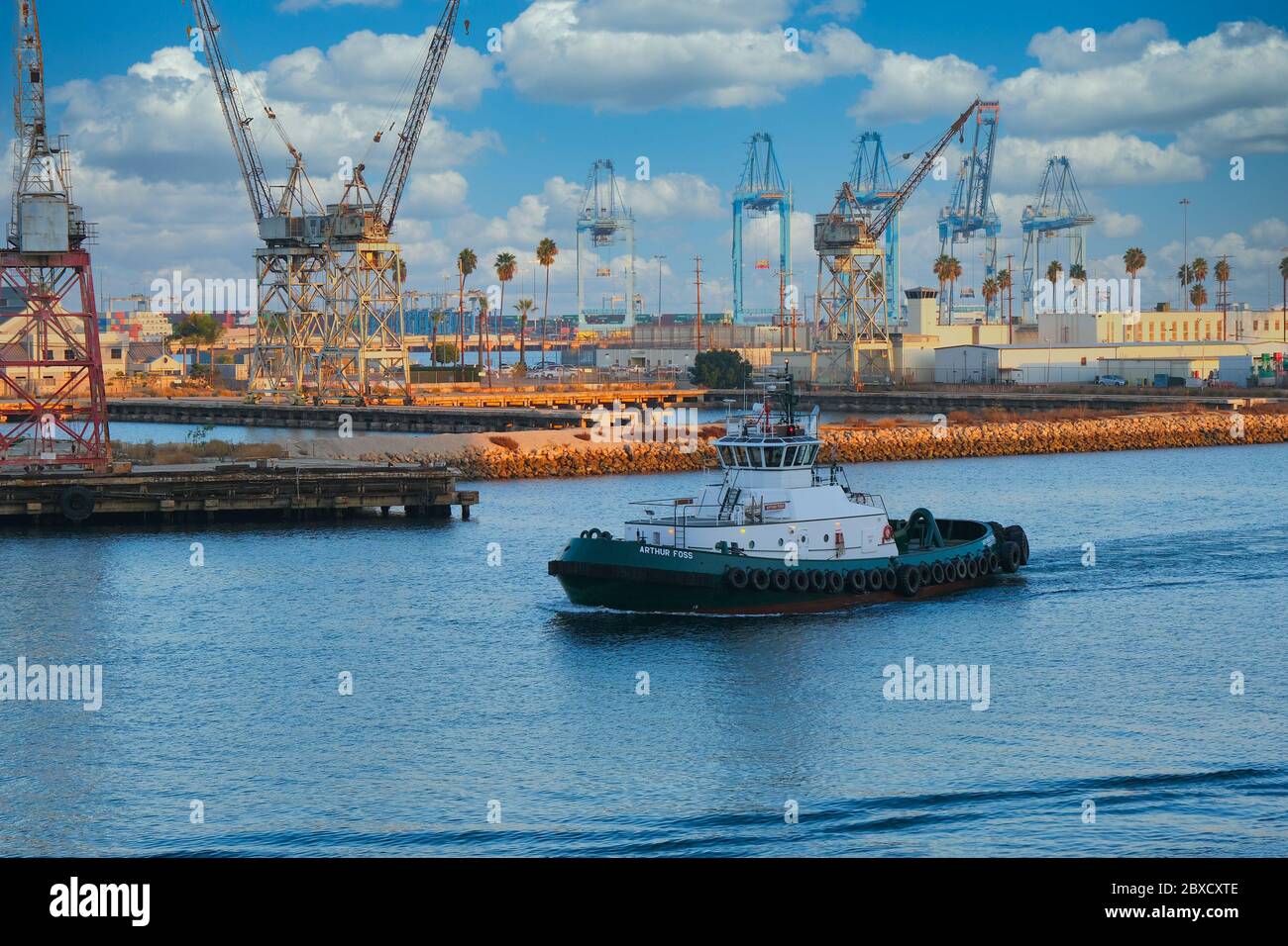 Tugboat Past Shipping Harbor Stock Photo - Alamy