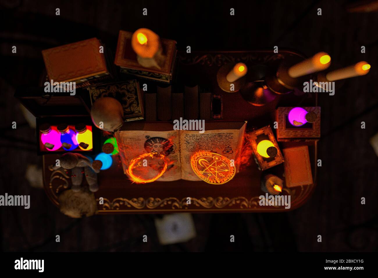 mystic room or alchemist`s study room with candles, books, bottles and ...