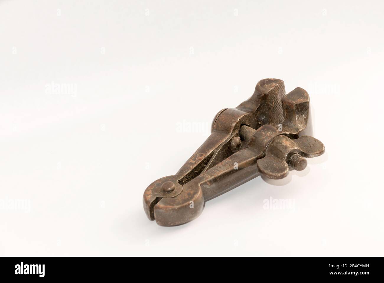 A cast iron miniature hand vise spring clamp used by jewelers on a ...