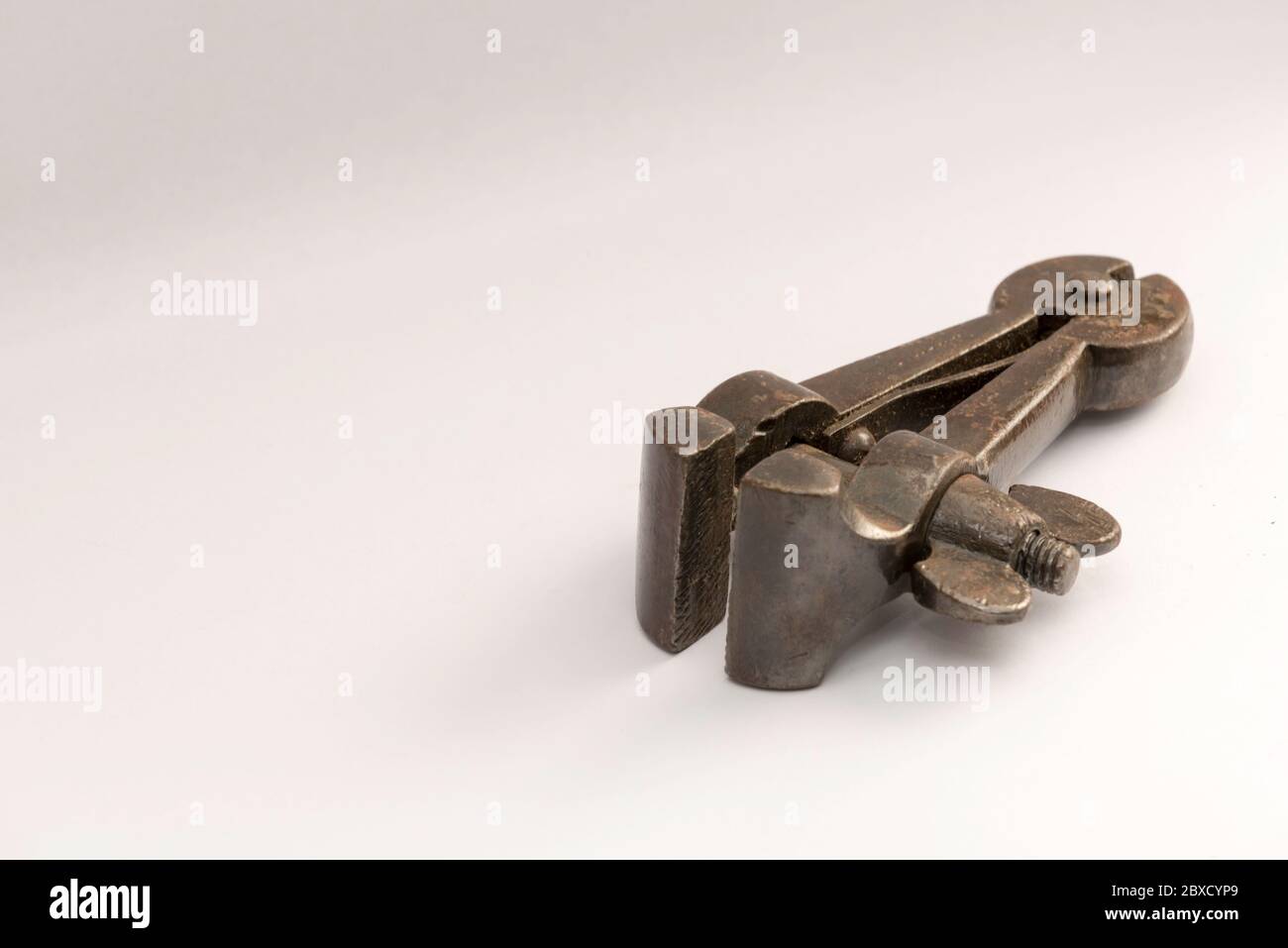 A cast iron miniature hand vise spring clamp used by jewelers on a ...