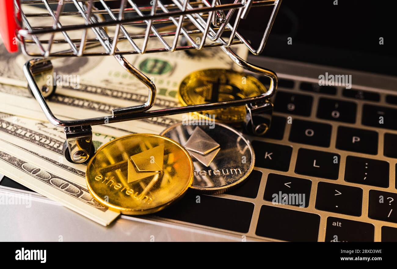 Shopping cart with golden ether coins or Ethereum network exchange and ...