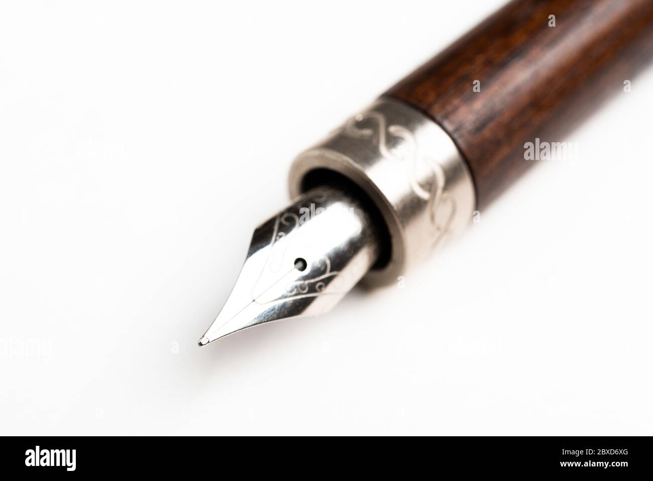 A close-up product shot of the wooden barrel and writing tip of a ...