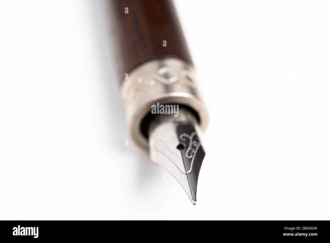 A close-up product shot of the wooden barrel and writing tip of a ...