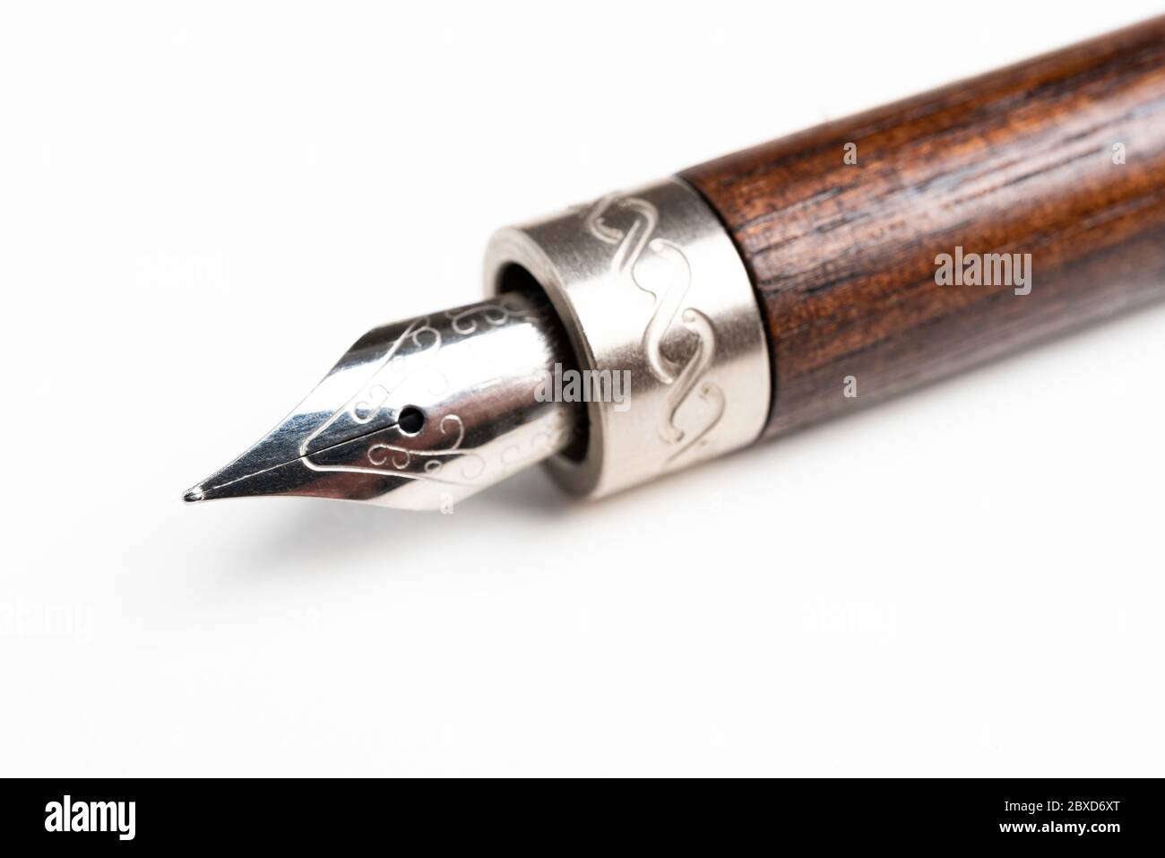 A close-up product shot of the wooden barrel and writing tip of a ...
