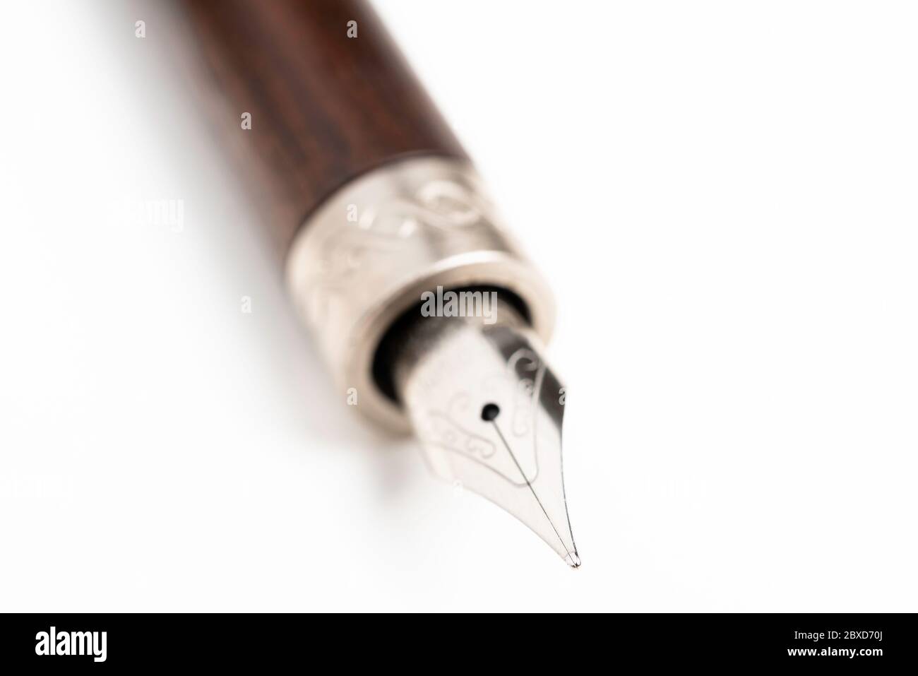 A close-up product shot of the wooden barrel and writing tip of a ...