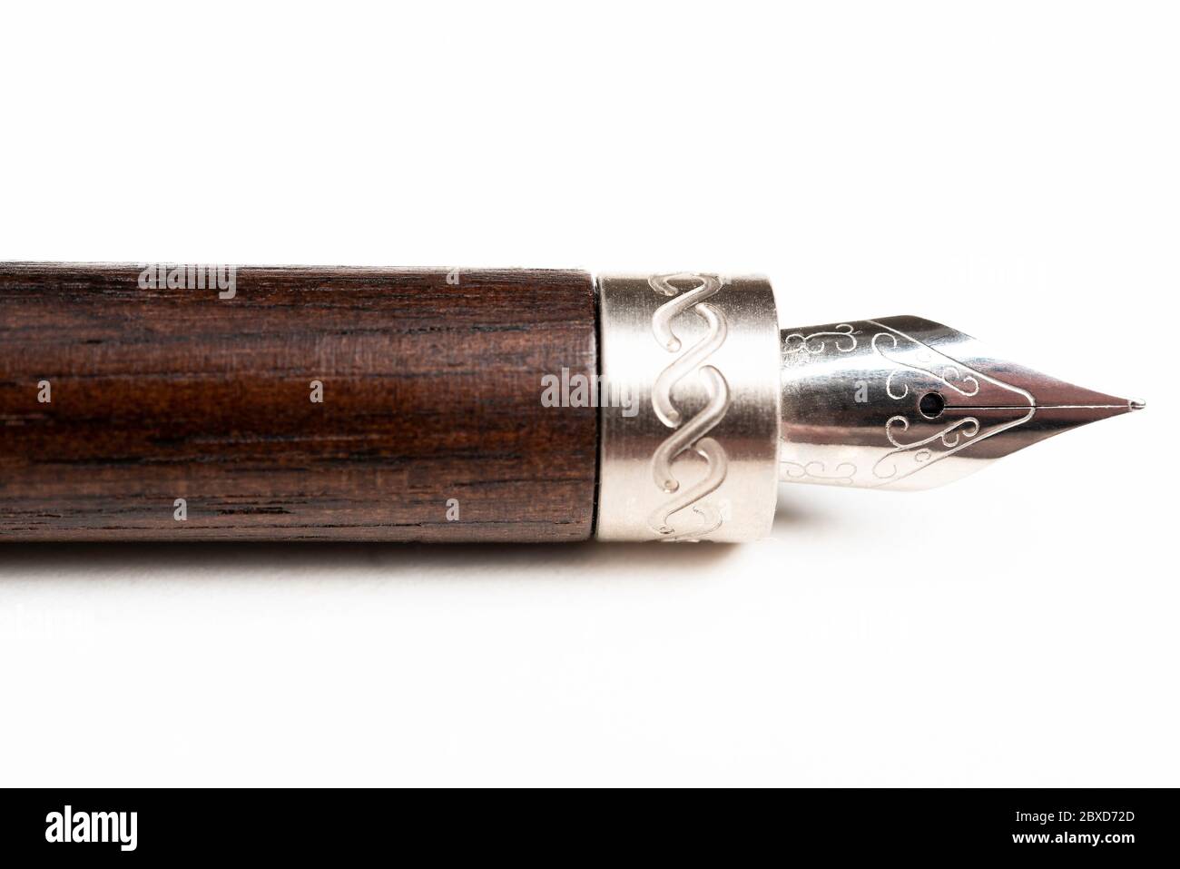 A close-up product shot of the wooden barrel and writing tip of a ...