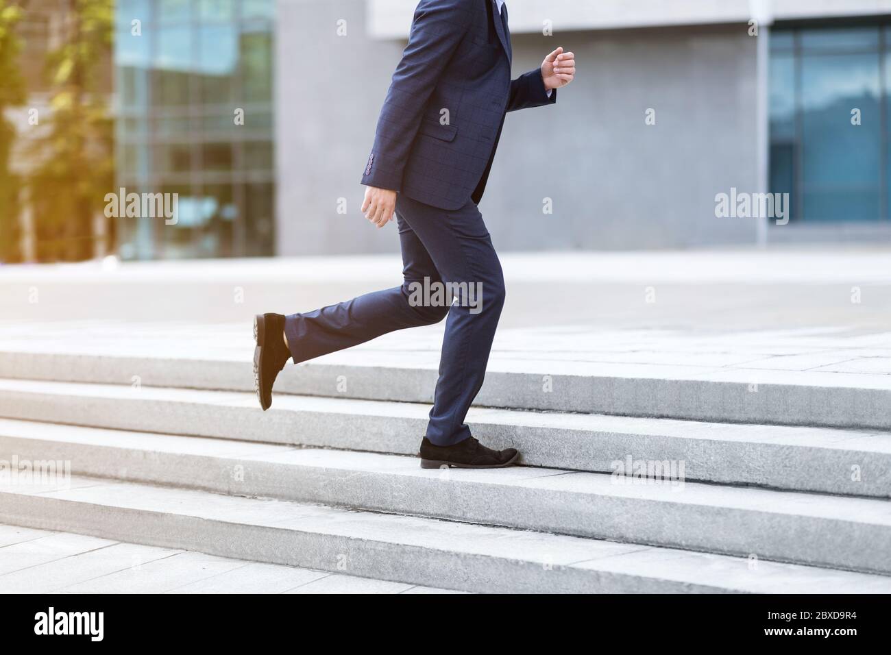 Business man running stairs hi-res stock photography and images - Alamy