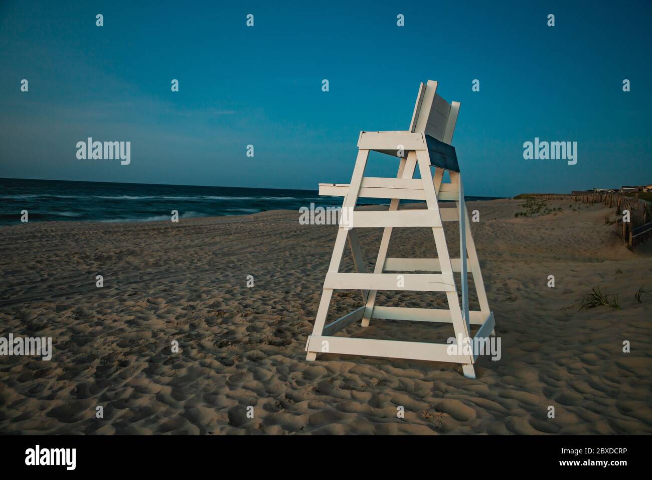 A lifeguard stand seems to be peering out to sea on the beach at Pearl ...