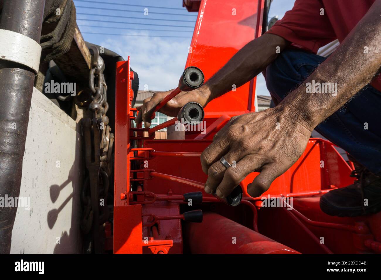 A worker hand with Lorry Crane control - Industrial Concept Stock Photo ...