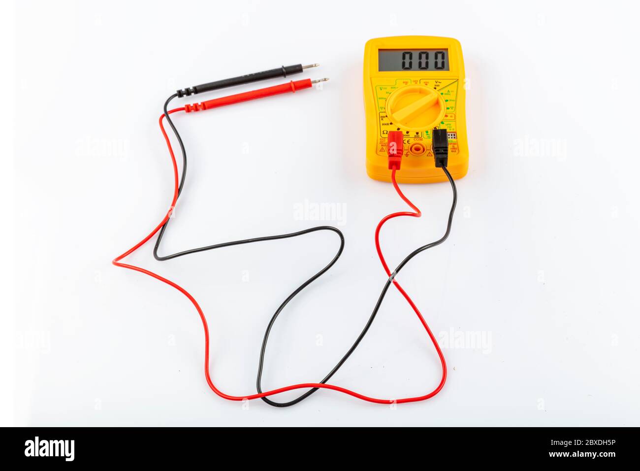 Digital yellow multimeter meter isolated to check the resistance on a ...