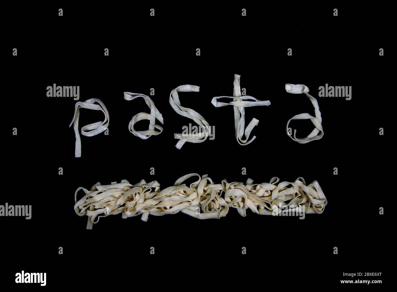 lettering PASTA, made of noodles and noodles on black background flat ...