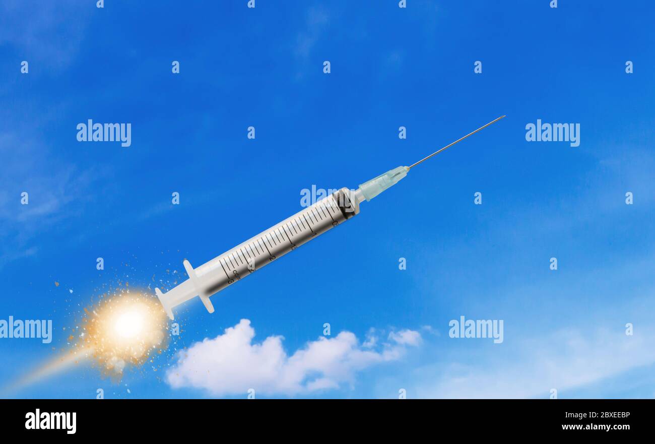 Syringe or injection needle launch on blue sky background, medical and ...