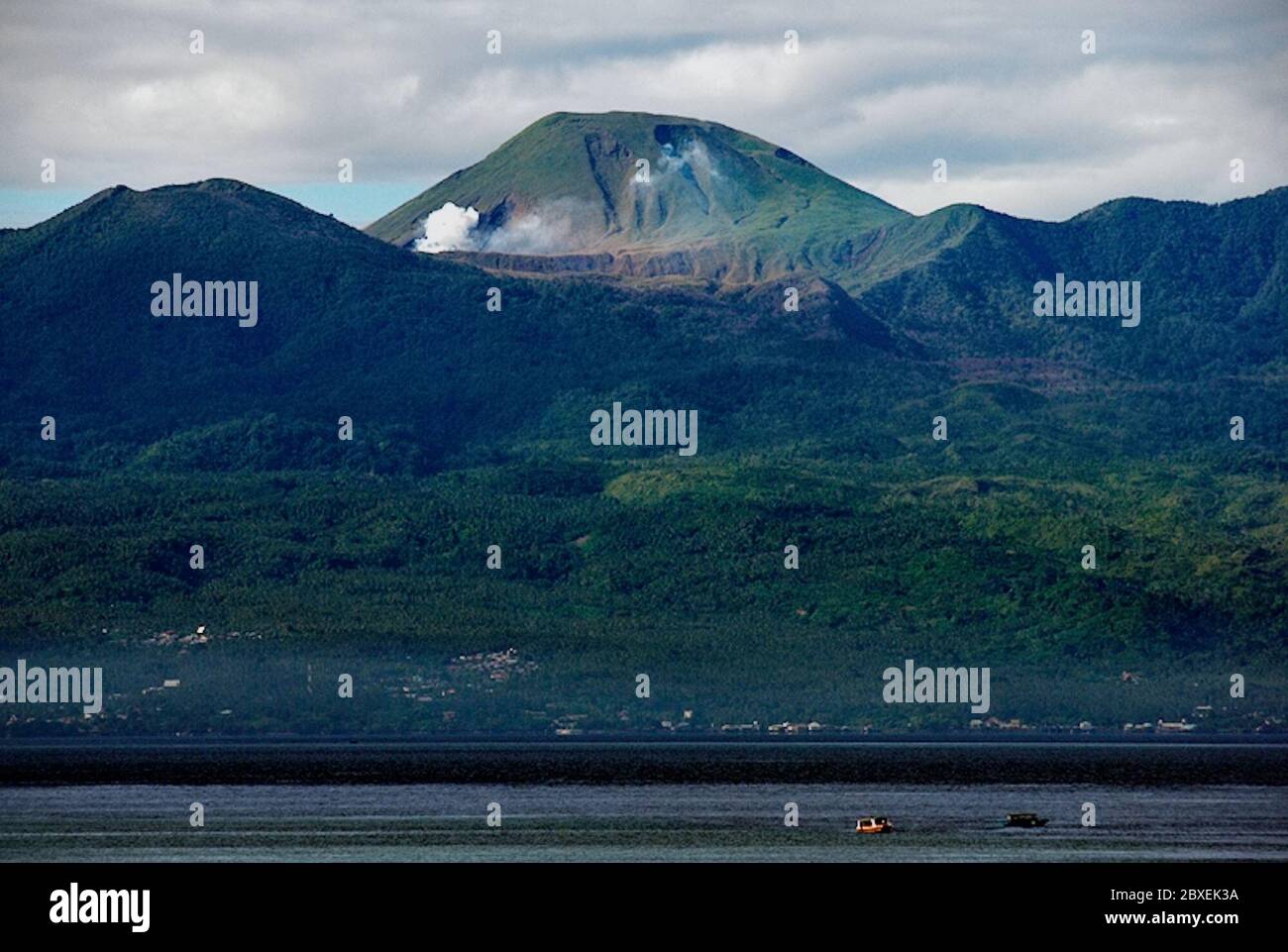 Mount Lokon volcano and North Sulawesi coastline are photographed from ...