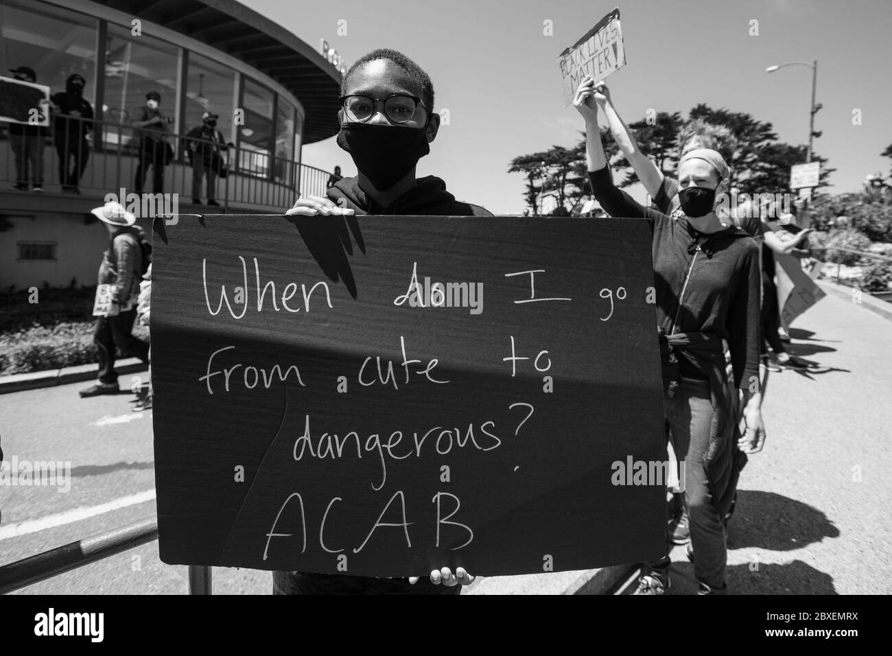 Protestors at gate Black and White Stock Photos & Images - Alamy