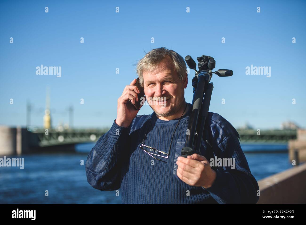 prominent man walks along the embankment Stock Photo - Alamy