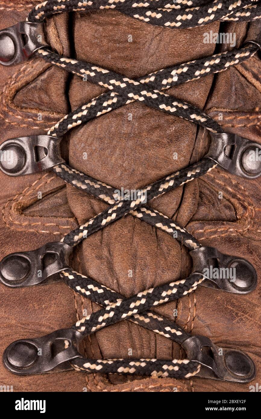 Laced up boots - laces are a cord or leather strip passed through ...