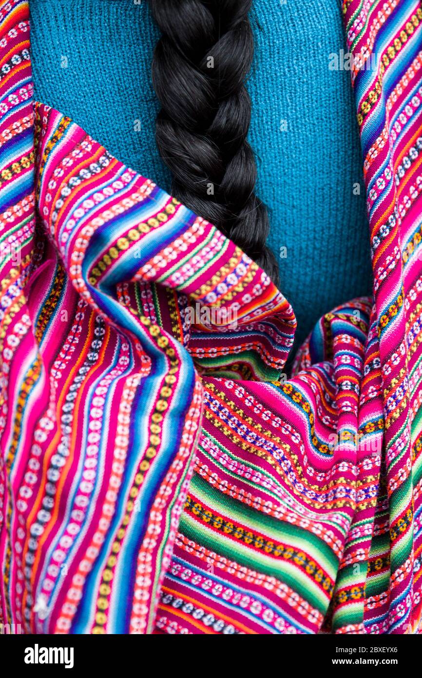 Closeup of Peruvian woman with the long black hair braids, wearing ...
