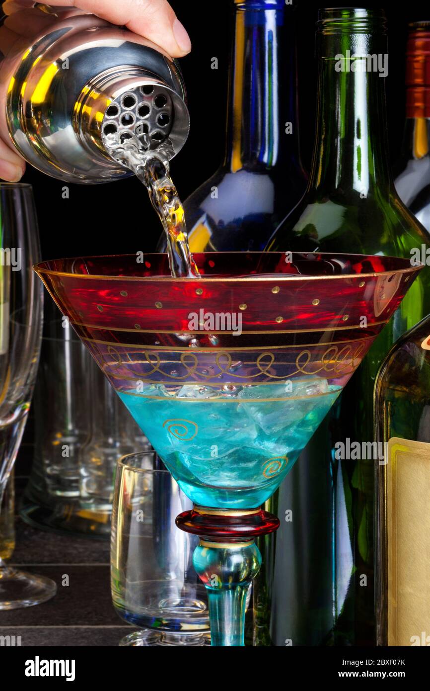 Bartender pouring drink from bottle hi-res stock photography and images ...