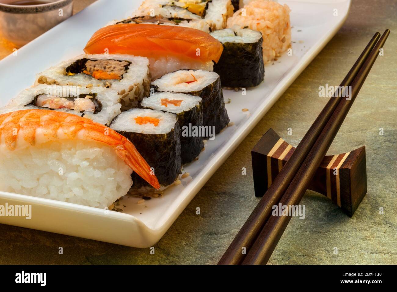 Sushi is a Japanese dish consisting of small balls or rolls of vinegar ...