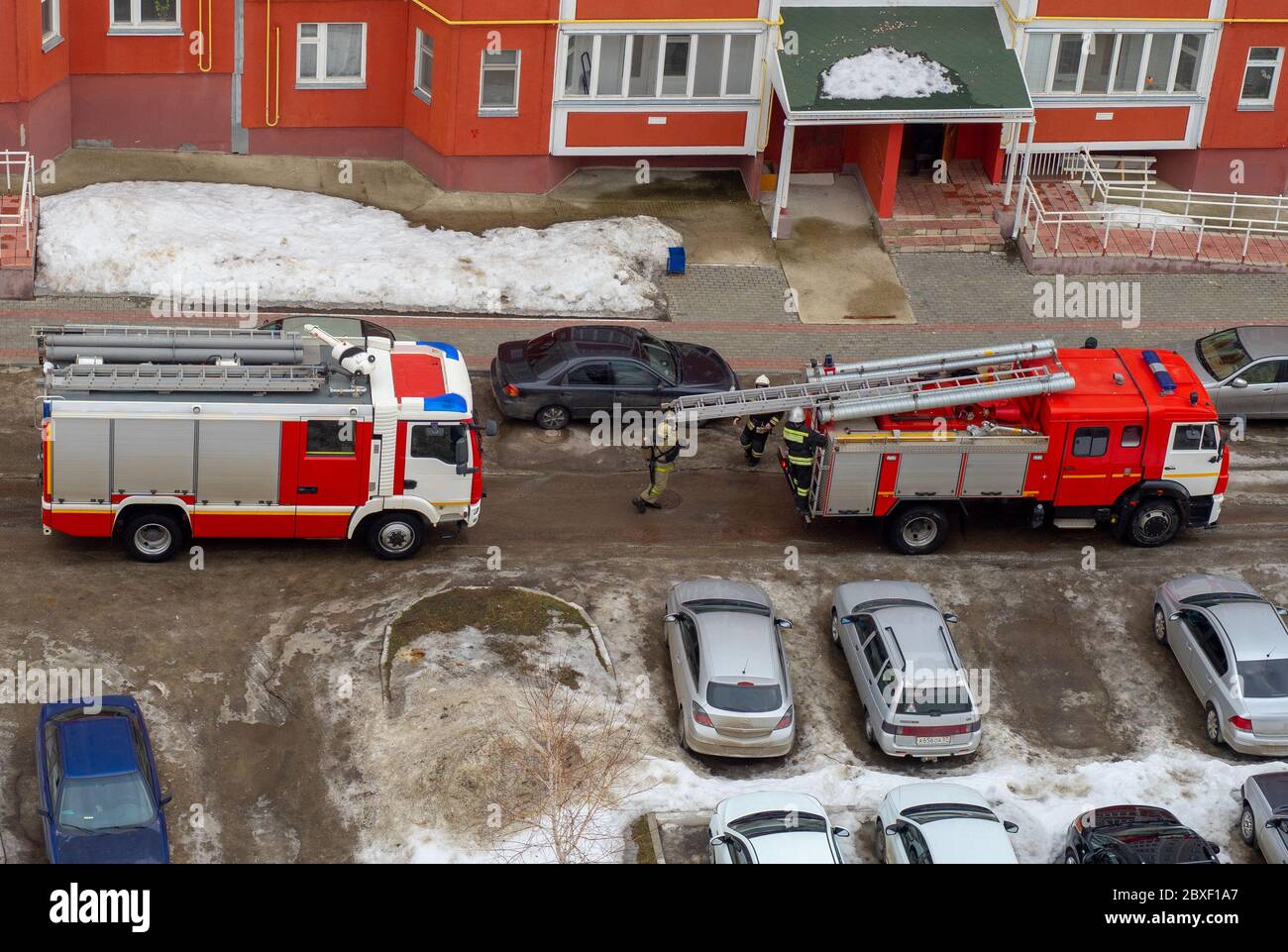 Fire engine in the courtyard of a multi-storey residential building in ...