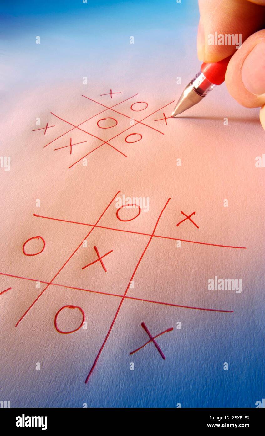 Playing noughts and crosses - also known as Tic-tac-toe Stock Photo - Alamy