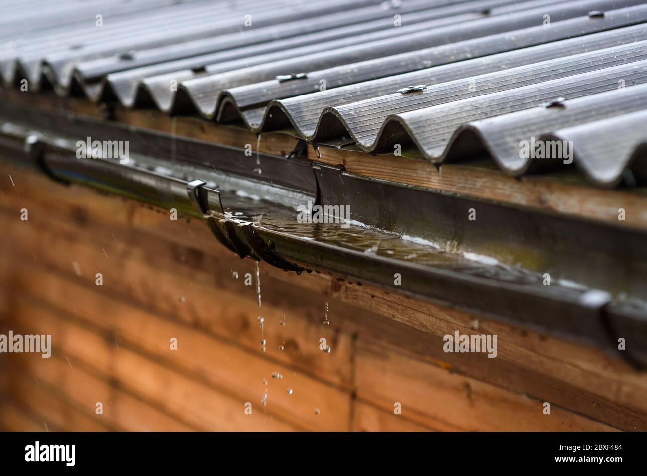 rain flows down from the roof Stock Photo - Alamy