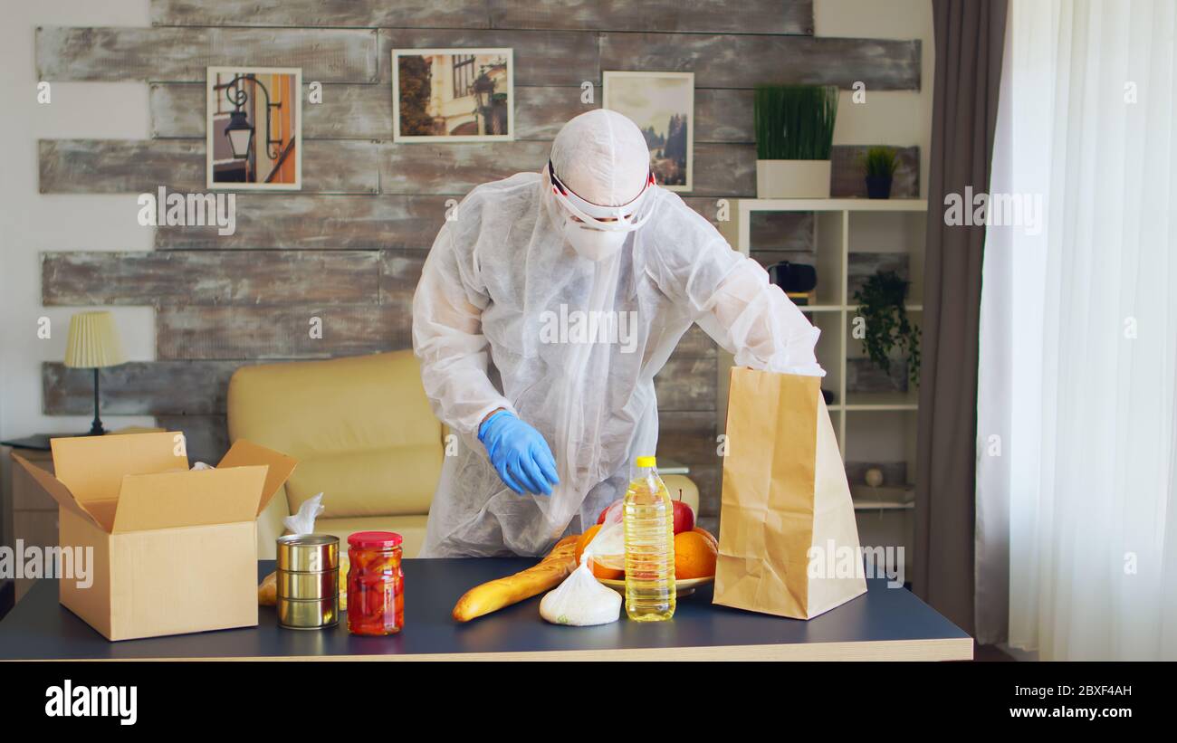 Man in protective suit packing hi-res stock photography and images - Alamy