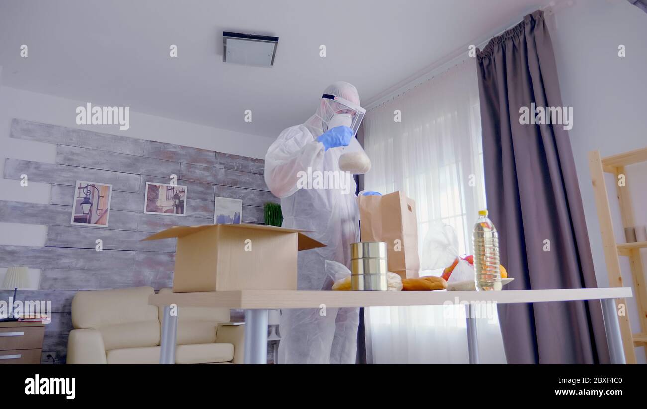 Man in protective suit packing hi-res stock photography and images - Alamy