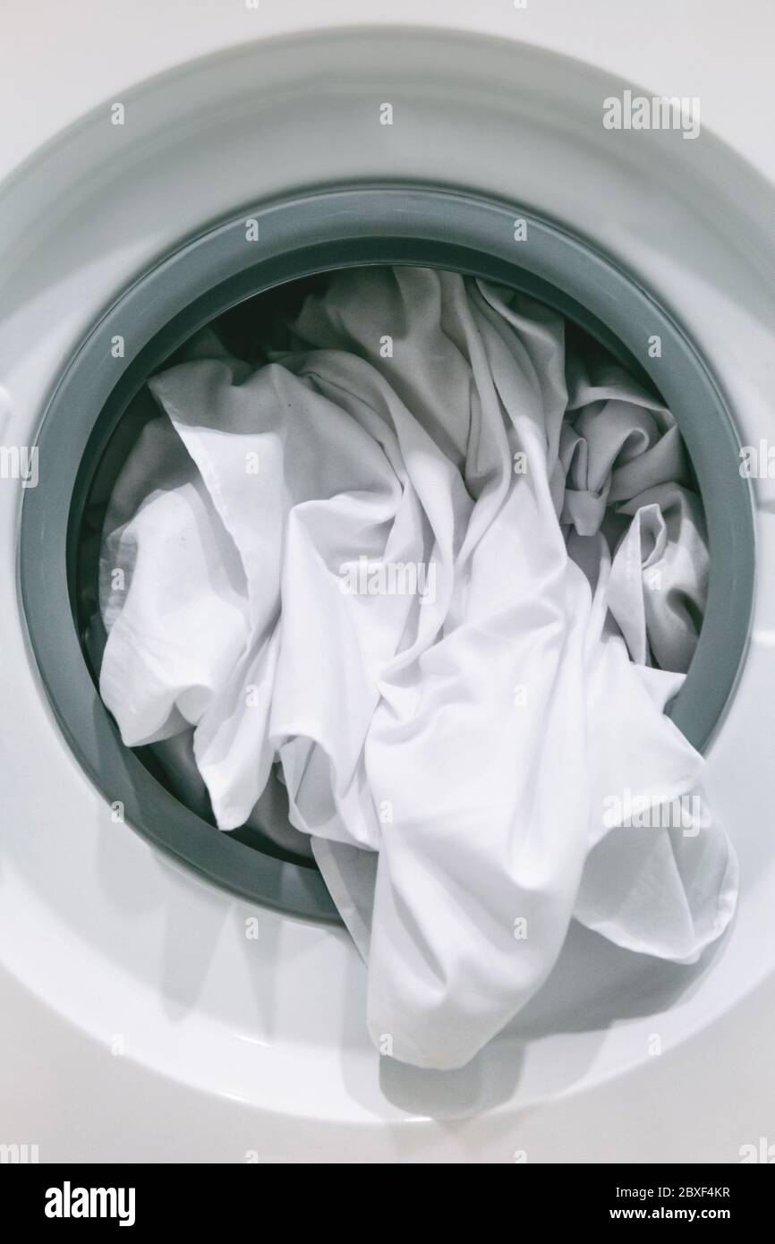 Laundry in a washing machine hi-res stock photography and images - Alamy