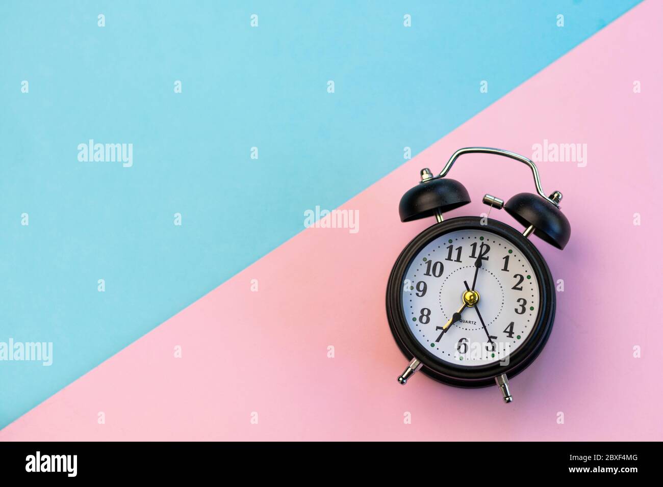 selective focus. clock alarm clock, electronic with seven o'clock hands ...