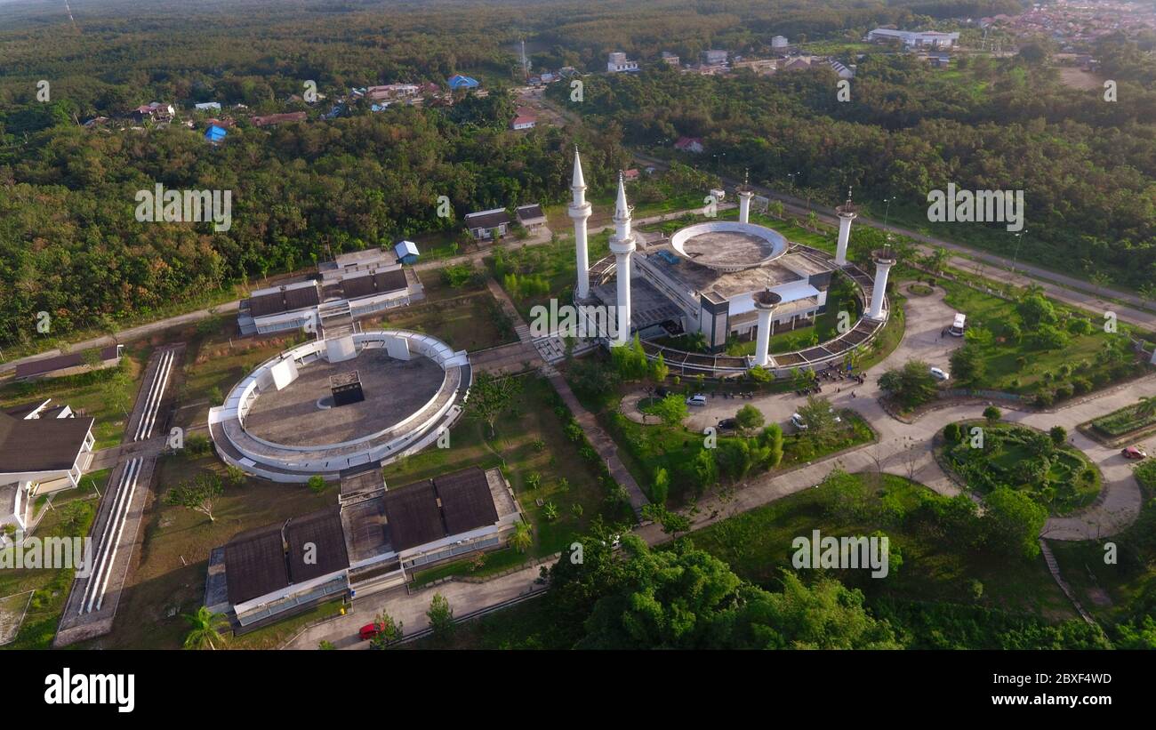 Aerial view of Al Abrar Mosque with forest background in the month of ...