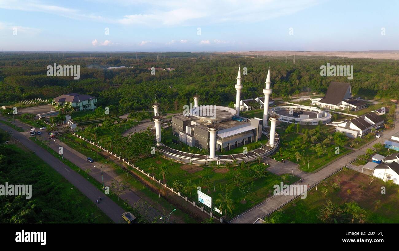 Aerial view of Al Abrar Mosque with forest background in the month of ...