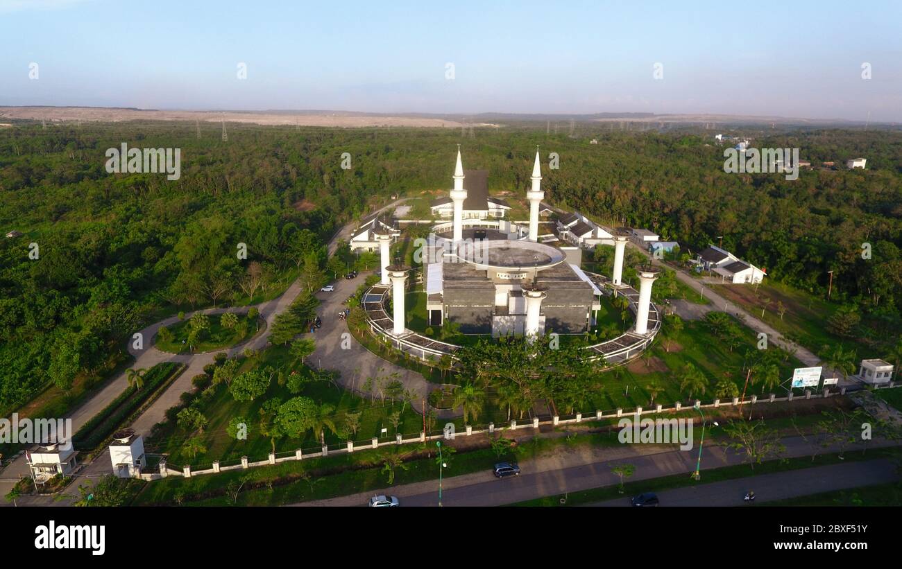 Aerial view of Al Abrar Mosque with forest background in the month of ...