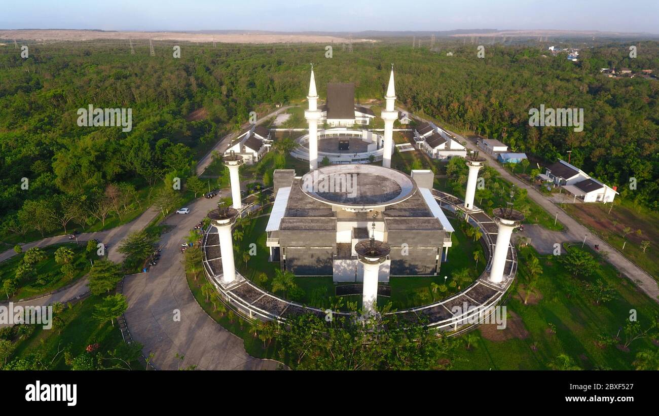 Aerial view of Al Abrar Mosque with forest background in the month of ...