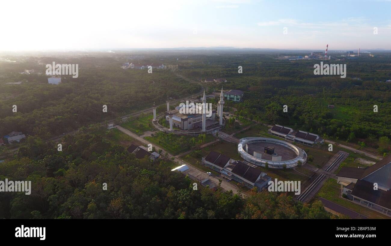 Aerial view of Al Abrar Mosque with forest background in the month of ...