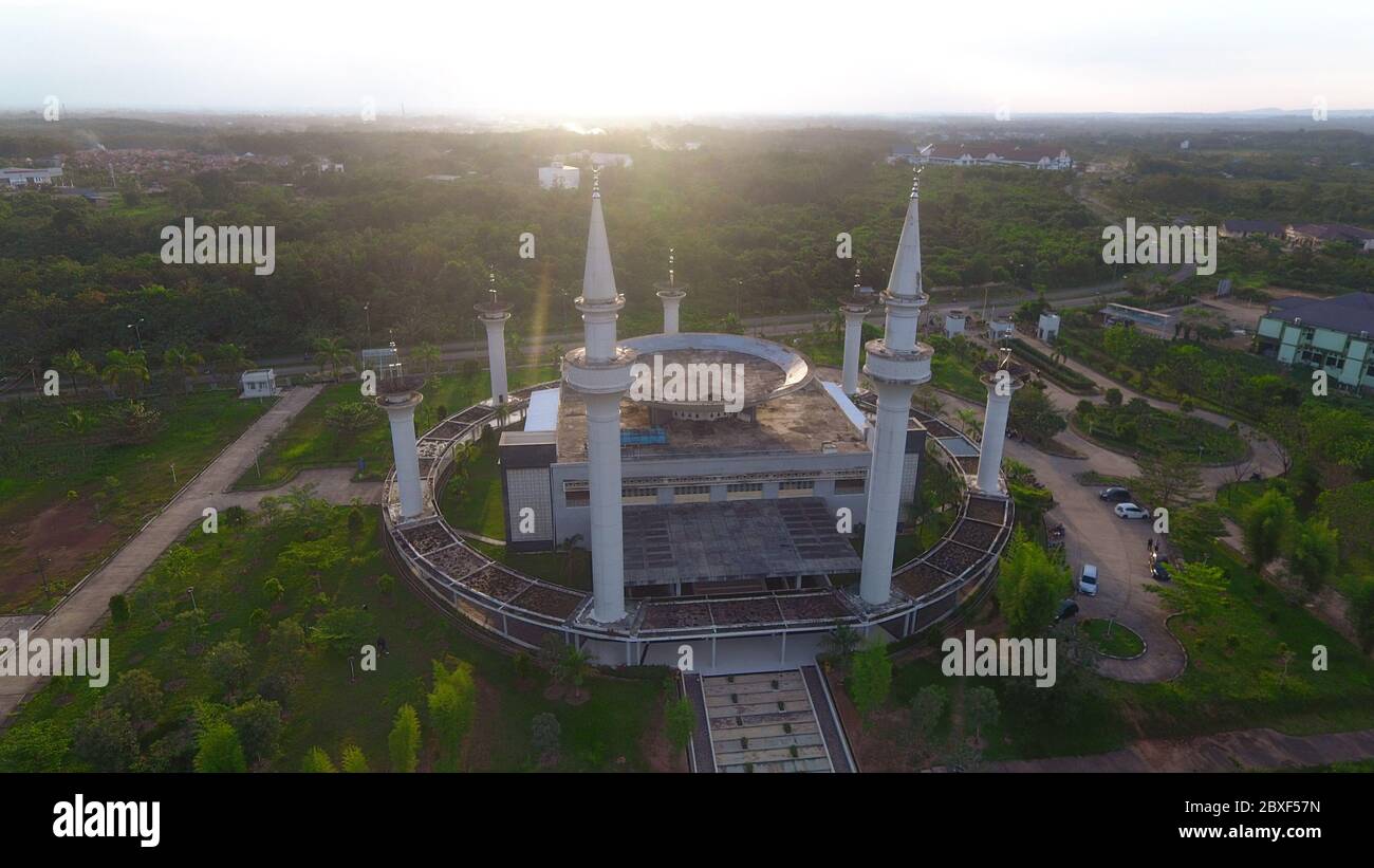 Aerial view of Al Abrar Mosque with forest background in the month of ...
