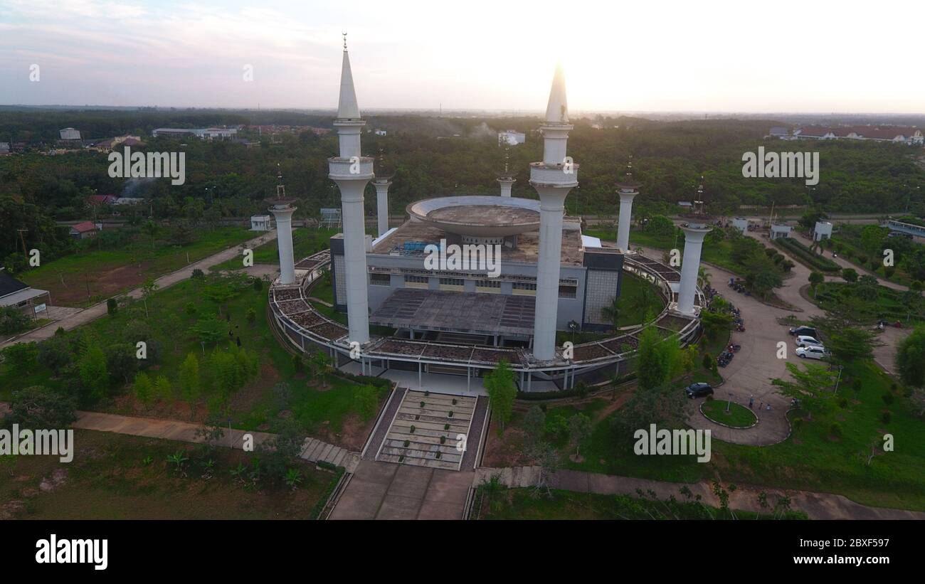 Aerial view of Al Abrar Mosque with forest background in the month of ...