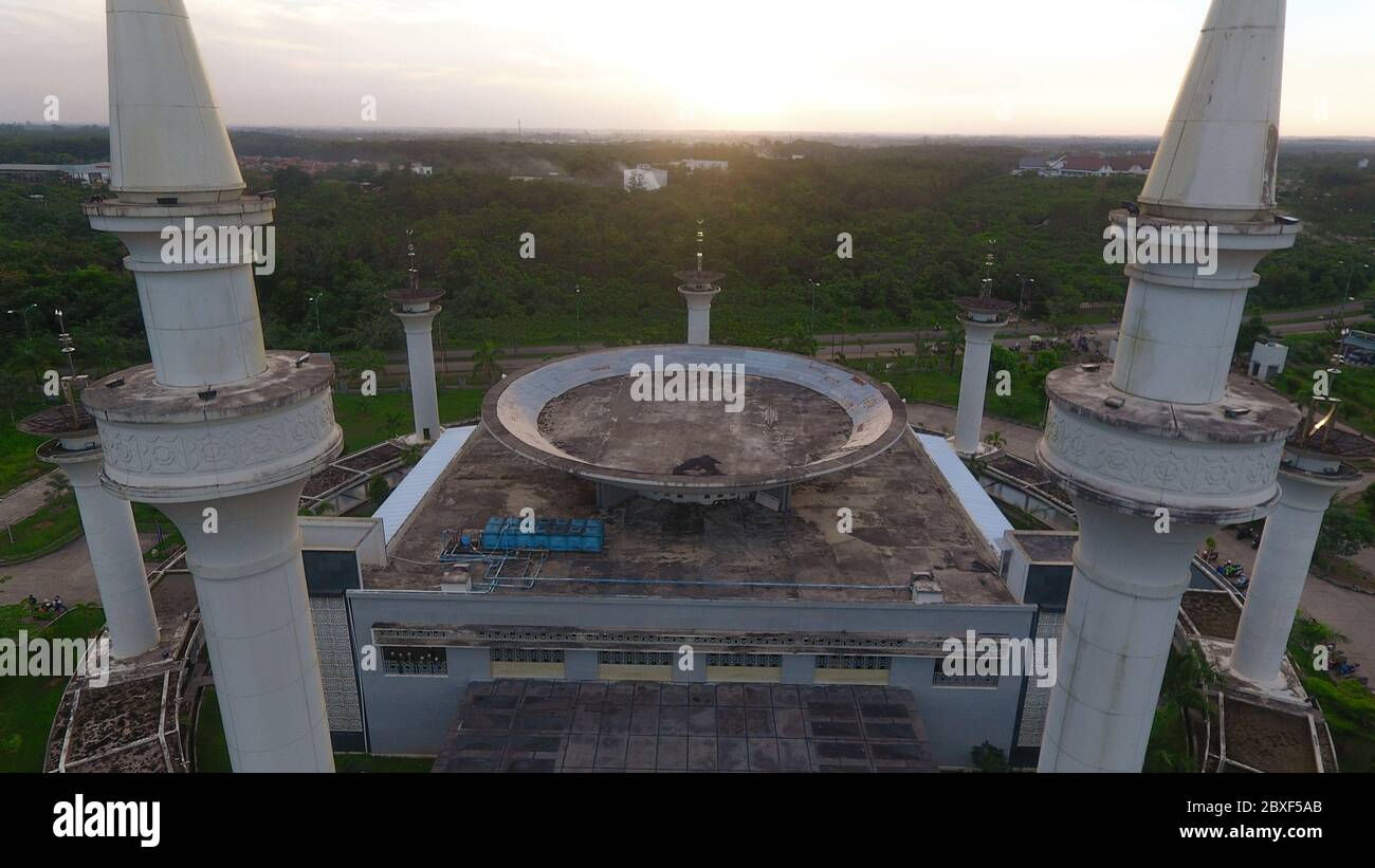 Aerial view of Al Abrar Mosque with forest background in the month of ...