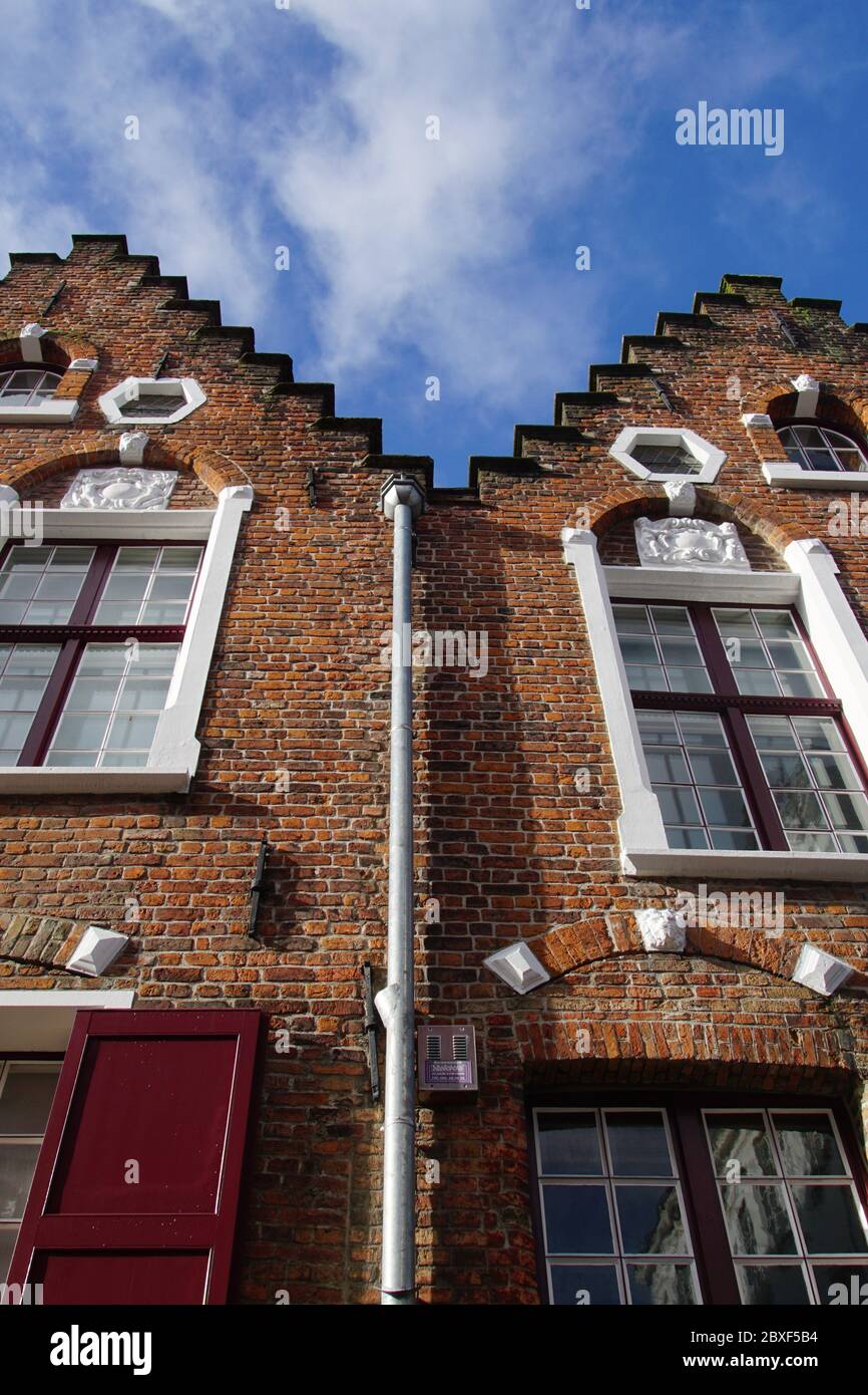 Low Angle View of a House with a Step Gable Roof in Bruges’ Old Town ...